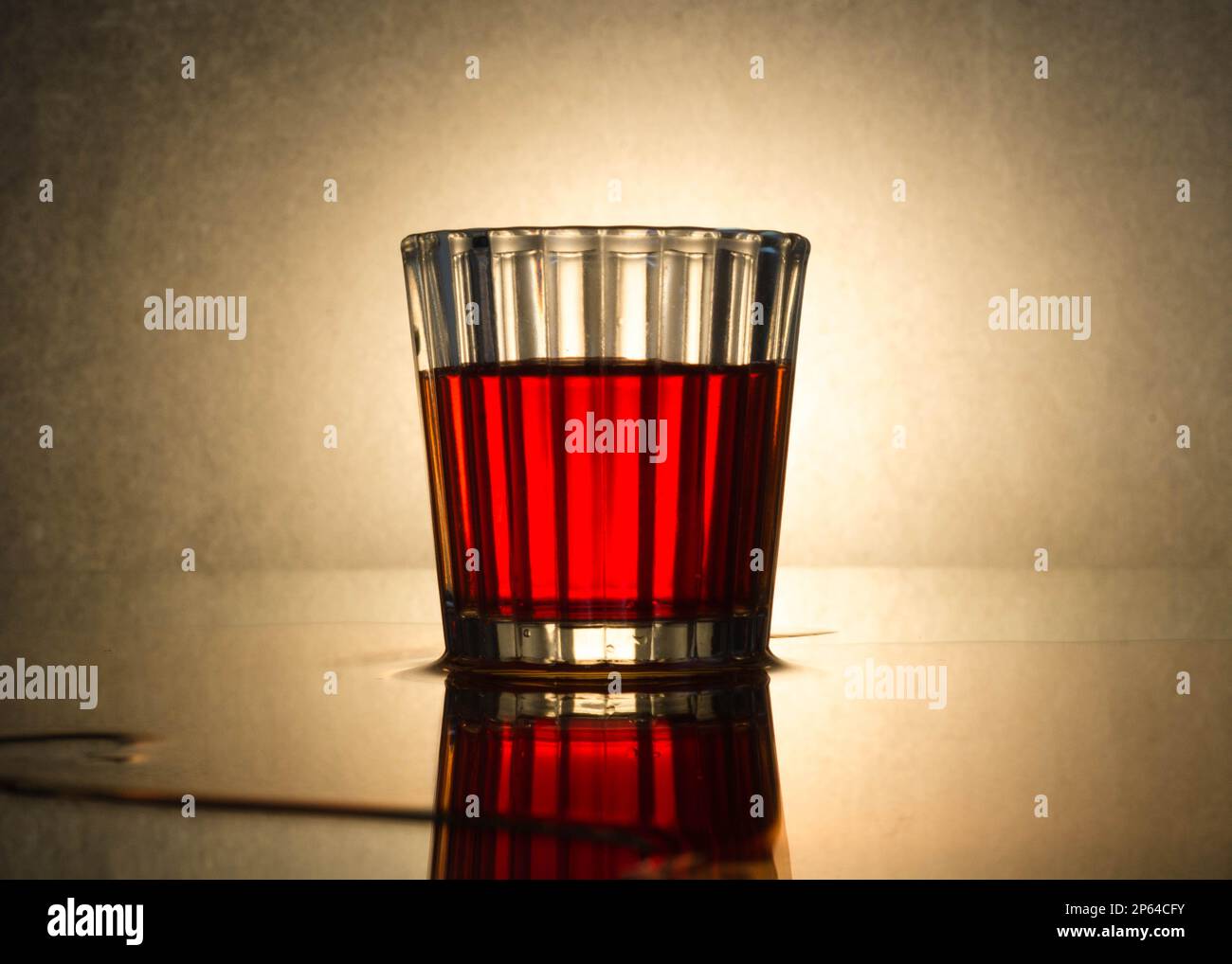 Cup of tea on a glass table with reflection on the surface Stock Photo ...