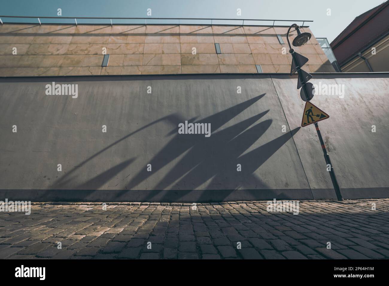 street partly in sun with road signs Stock Photo - Alamy