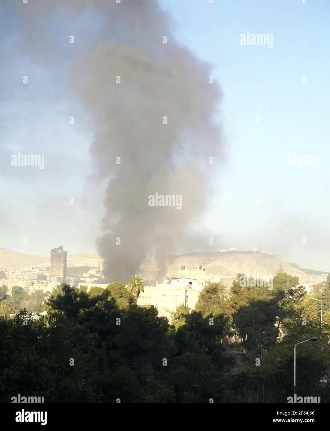 Smoke rises after two cars bombs detonated at Syria army headquarters ...