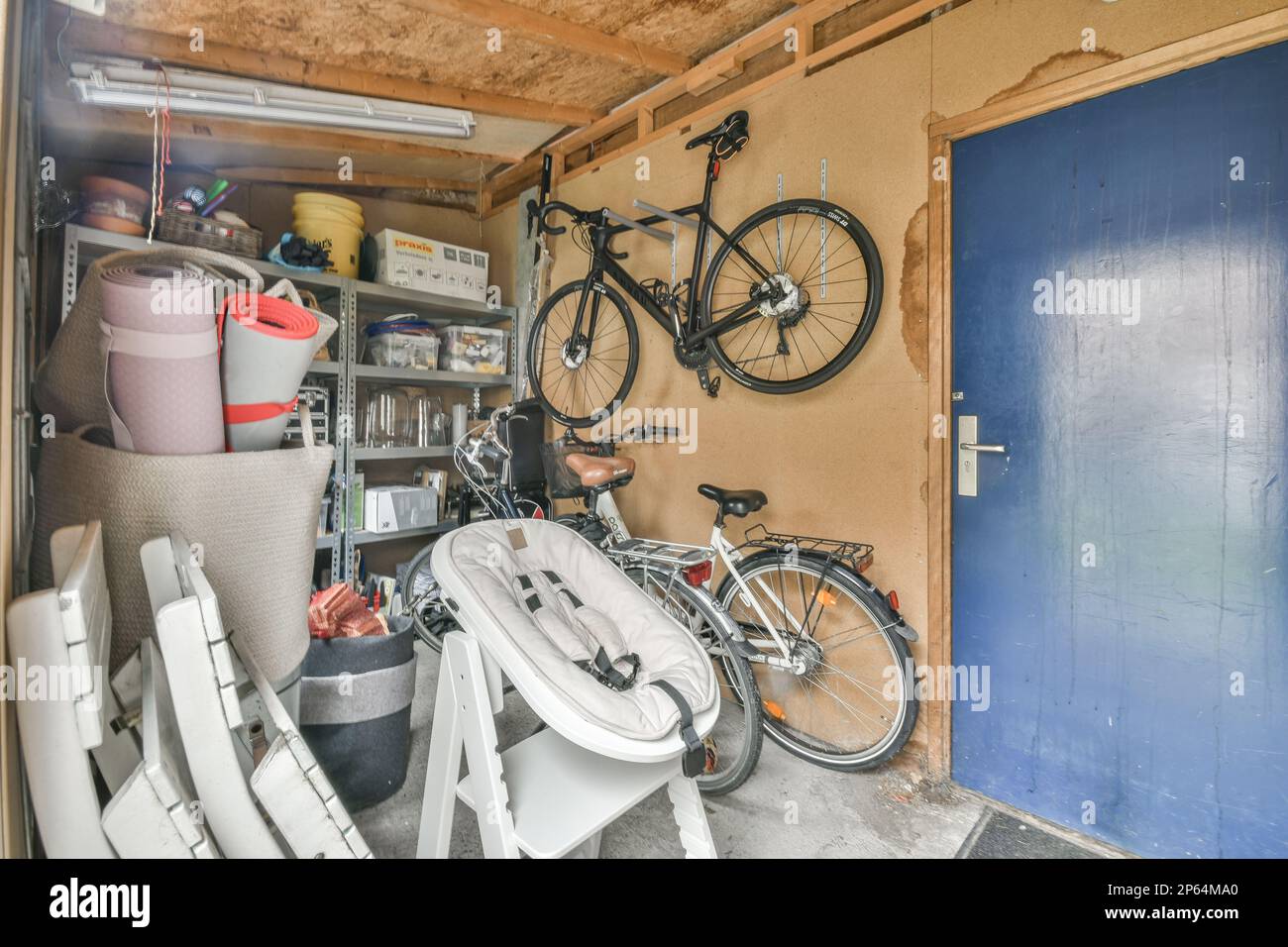 the inside of a garage with two bikes parked in front of it and one ...