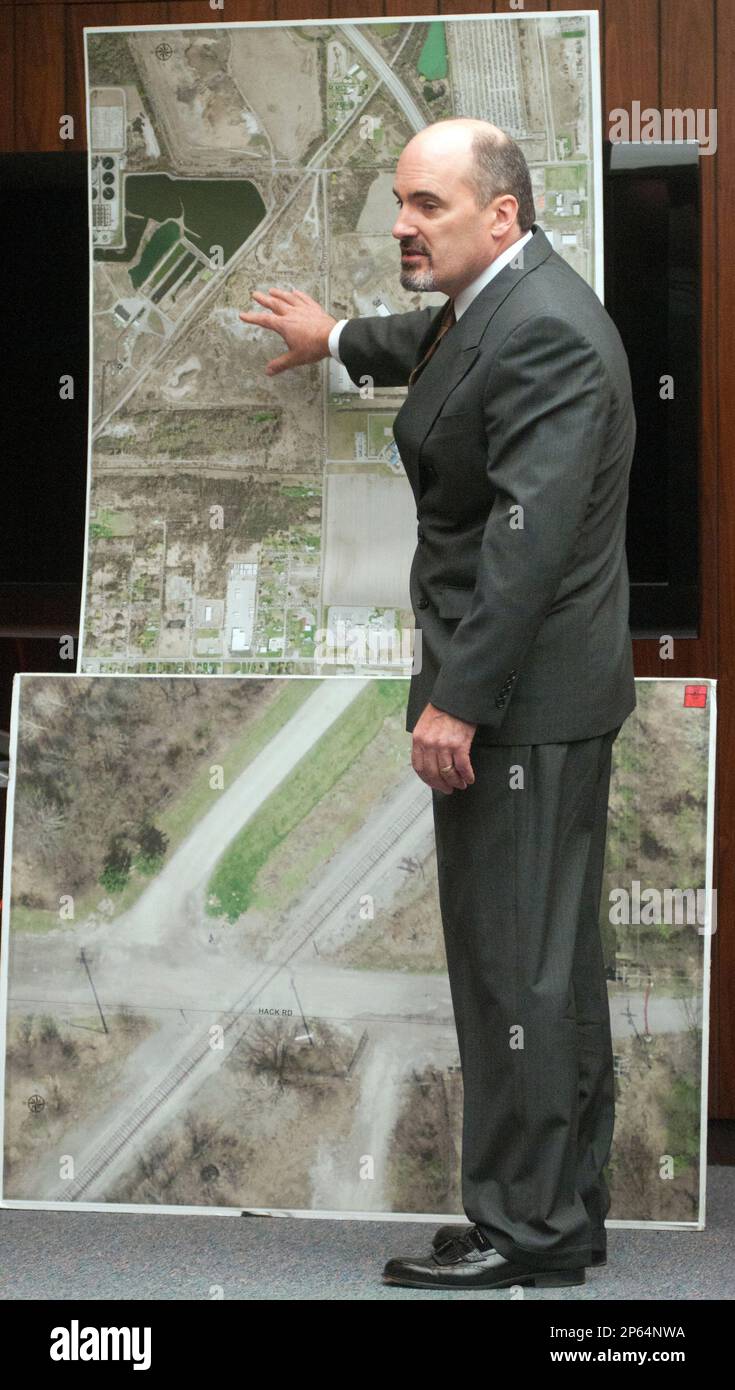 Chief Assistant Prosecutor Jeff Stroud uses aerial photos to describe ...
