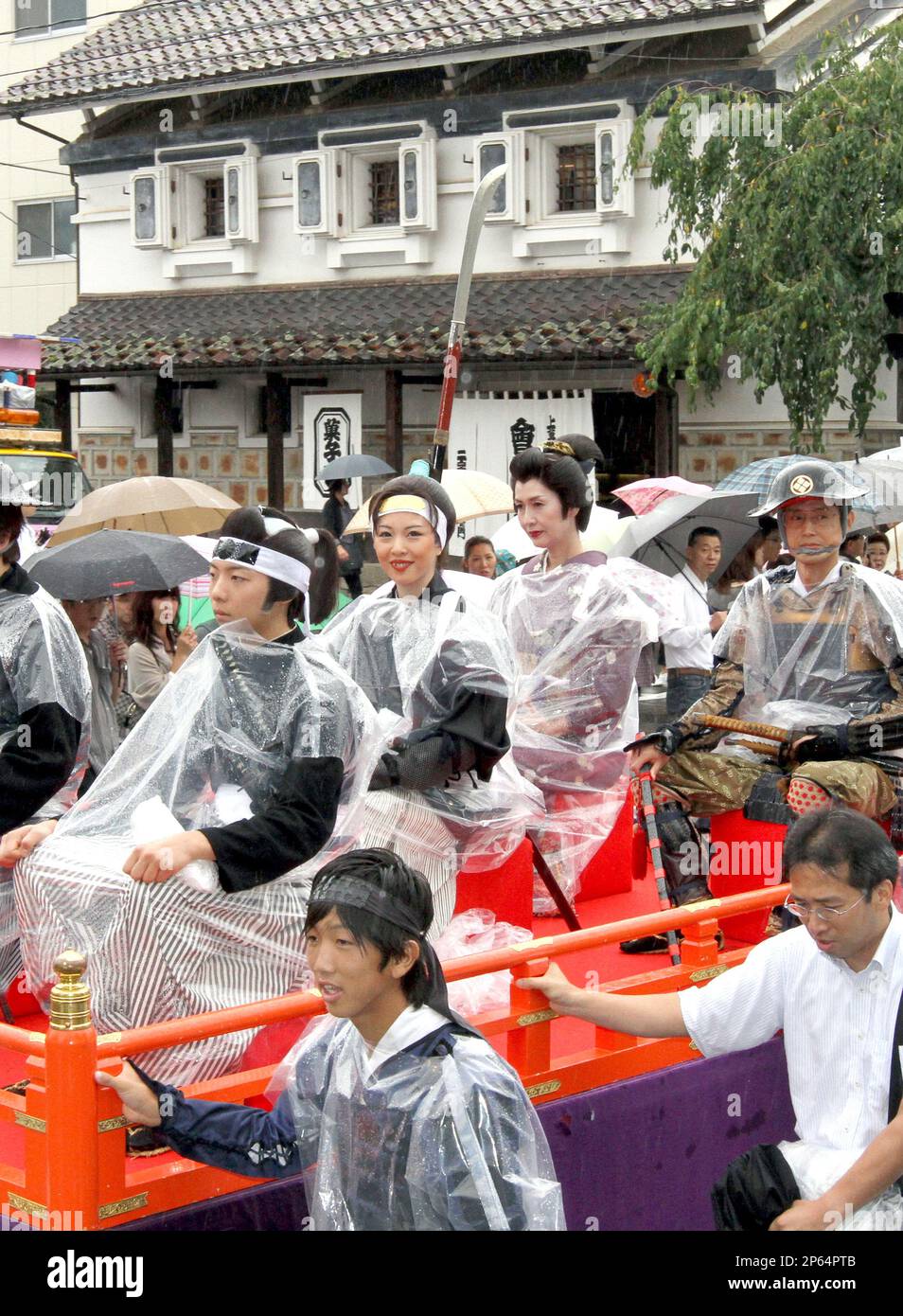 Parade participants, clad in samurai costumes, start their procession ...