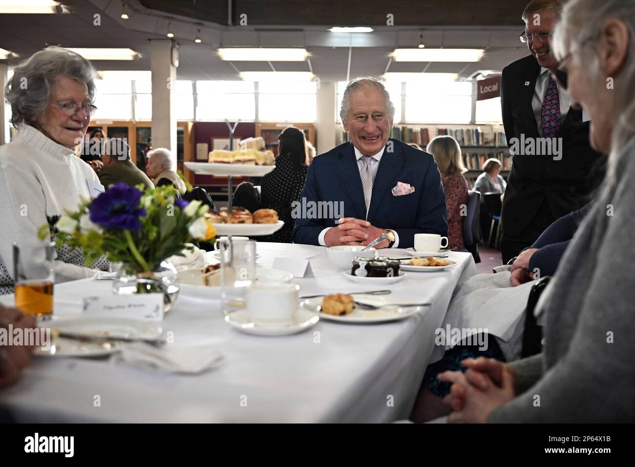Britain's King Charles III, center, meets volunteers and service users ...