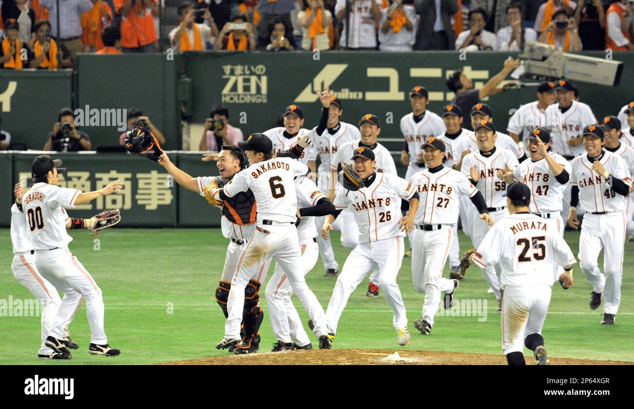 The Yomiuri Giants players celebrate after winning the Central Leagure ...