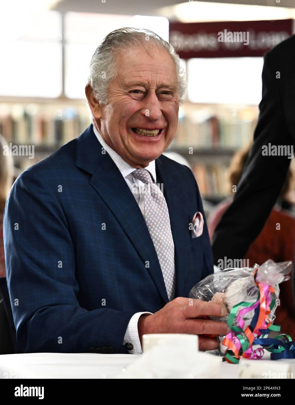 King Charles III is given a gift as he takes afternoon tea with Age UK ...