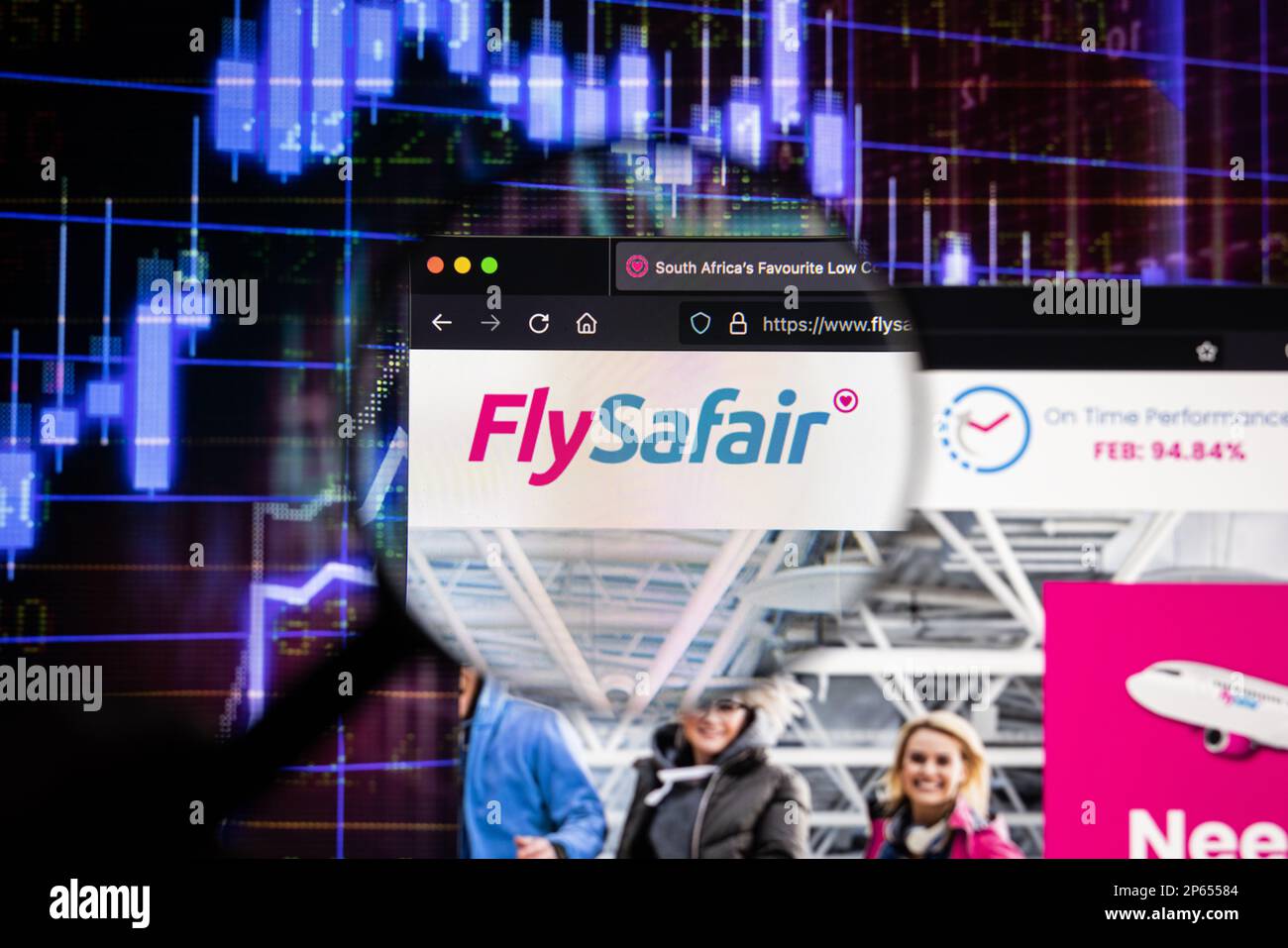 FlySafair airline company logo on a website with blurry stock market developments in the ...