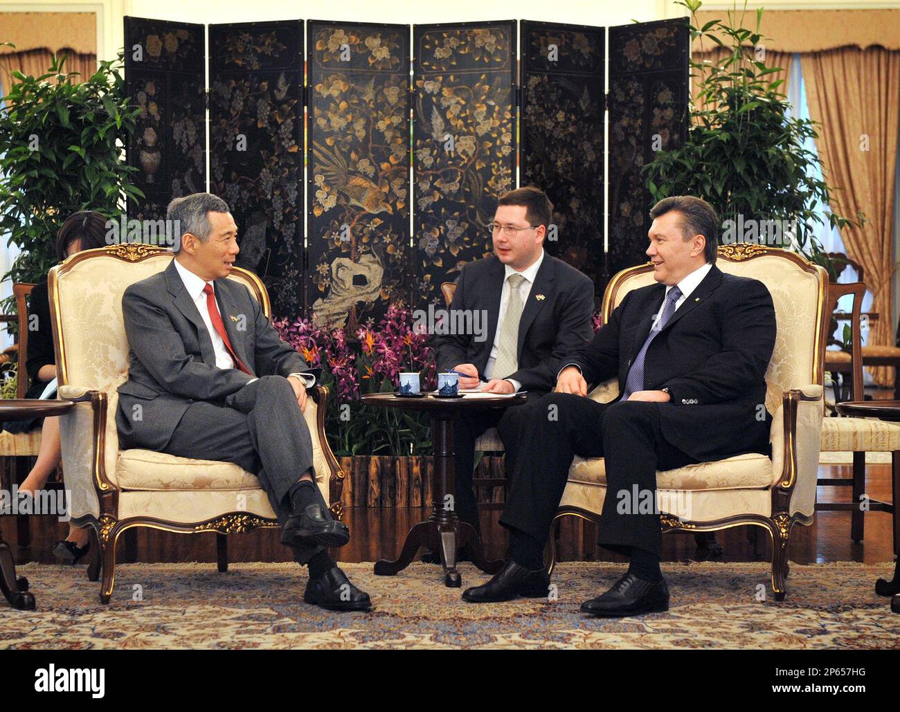 Ukraine’s President Viktor Yanukovych (right) calling on Prime Minister ...