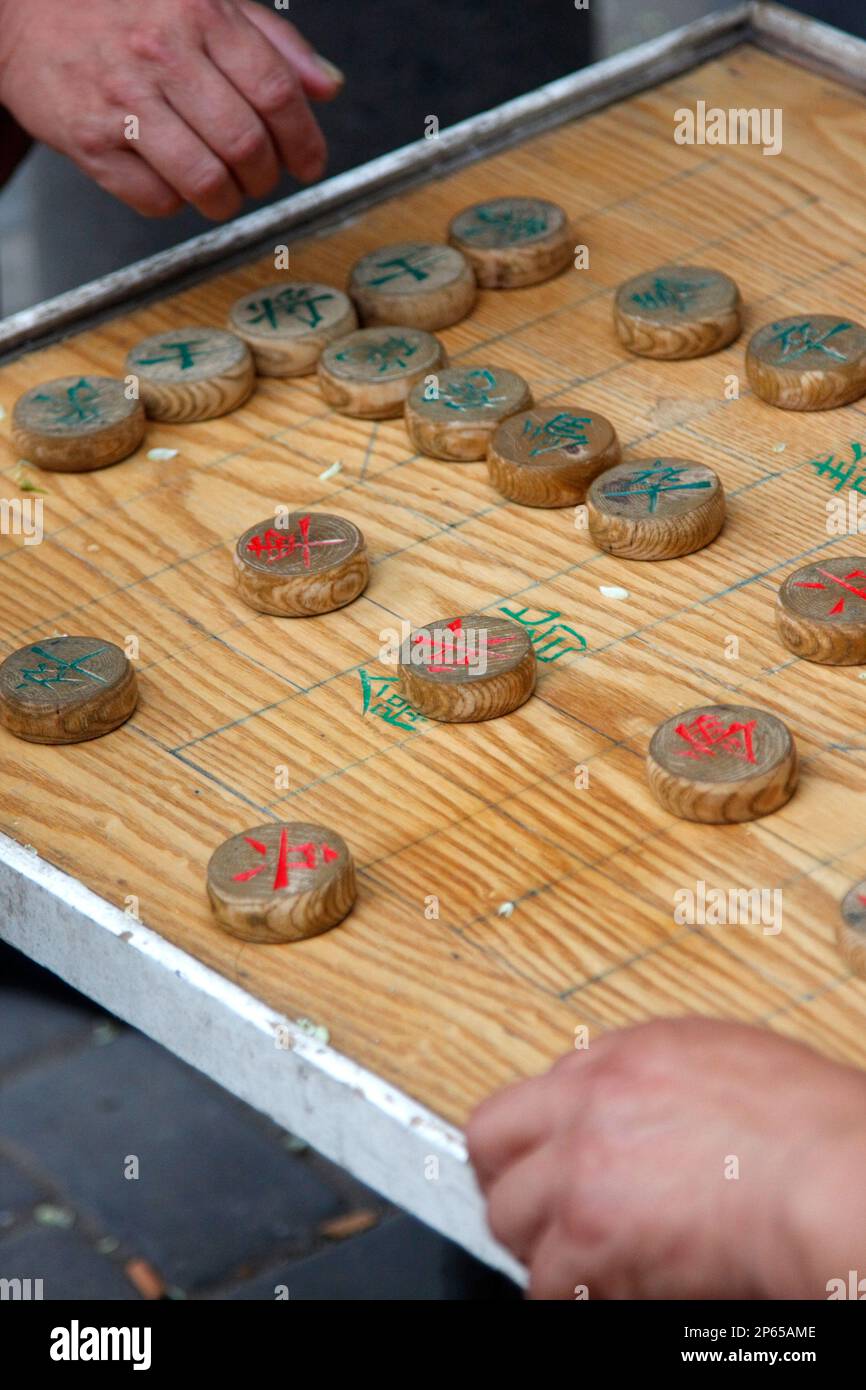 people playing Chinese checkers on the street. Beijing, China Stock ...