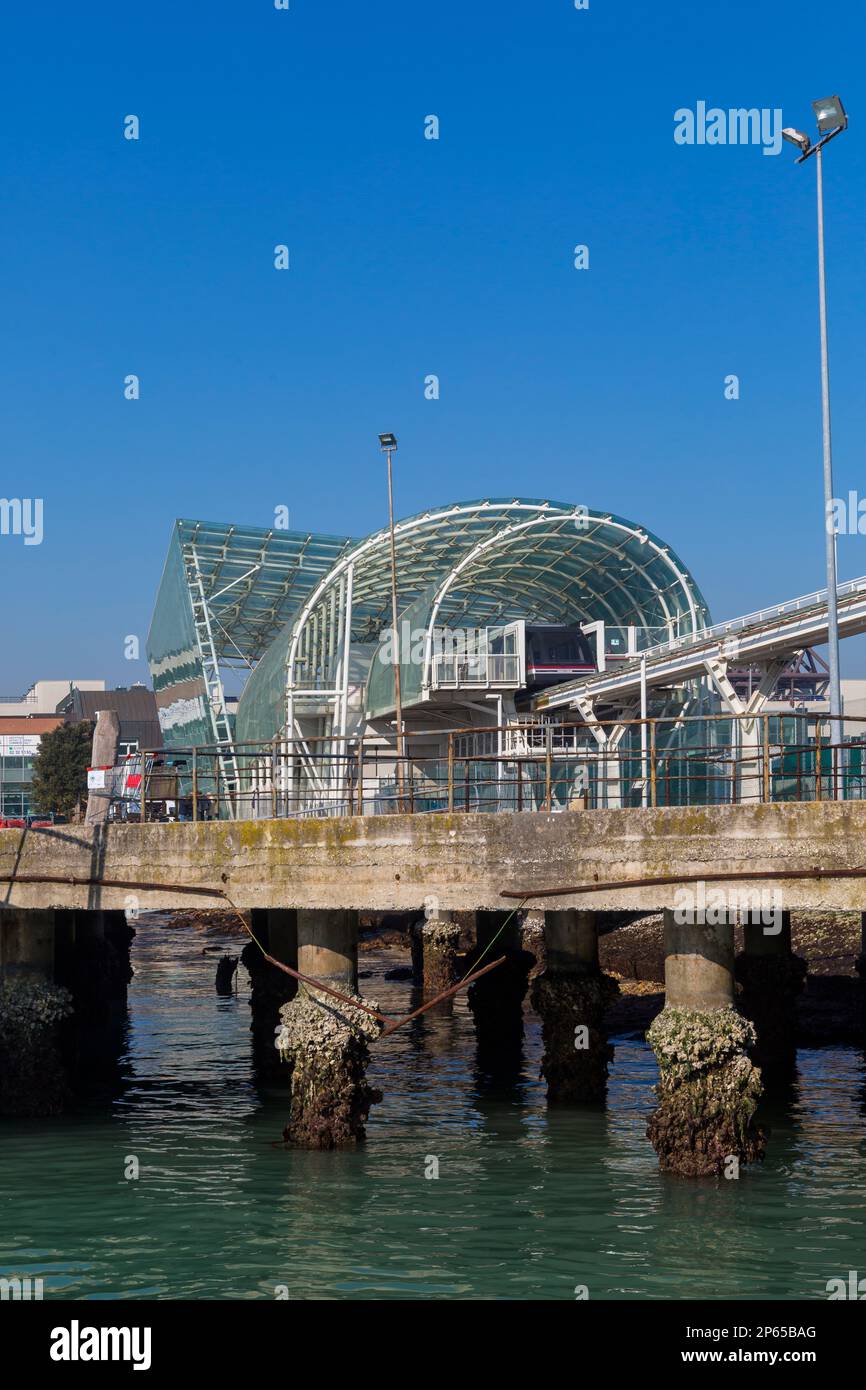 Glass train station, monorail, people mover shuttle service taking ...