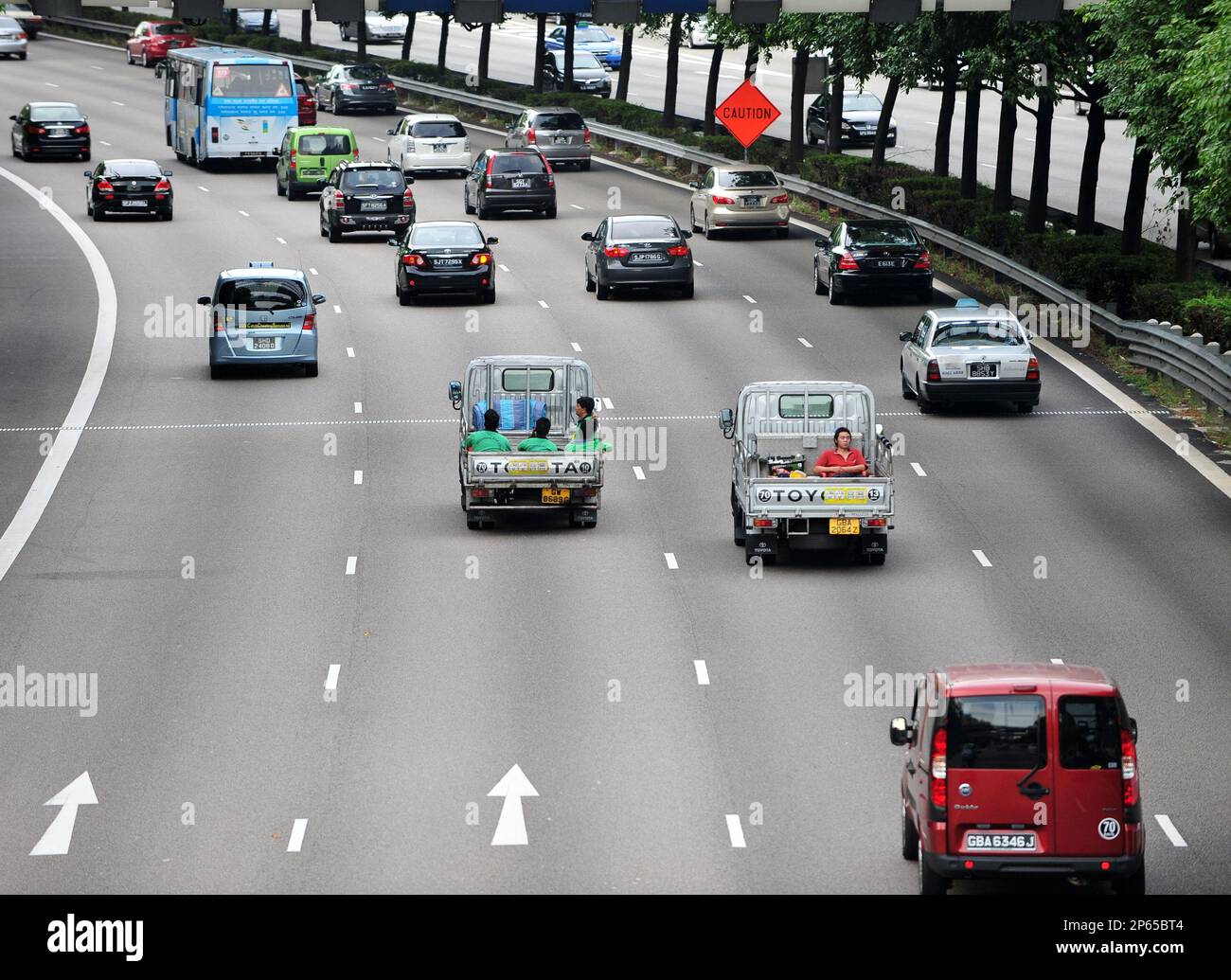 Light goods vehicles on the Central Expressway (CTE) carry workers ...