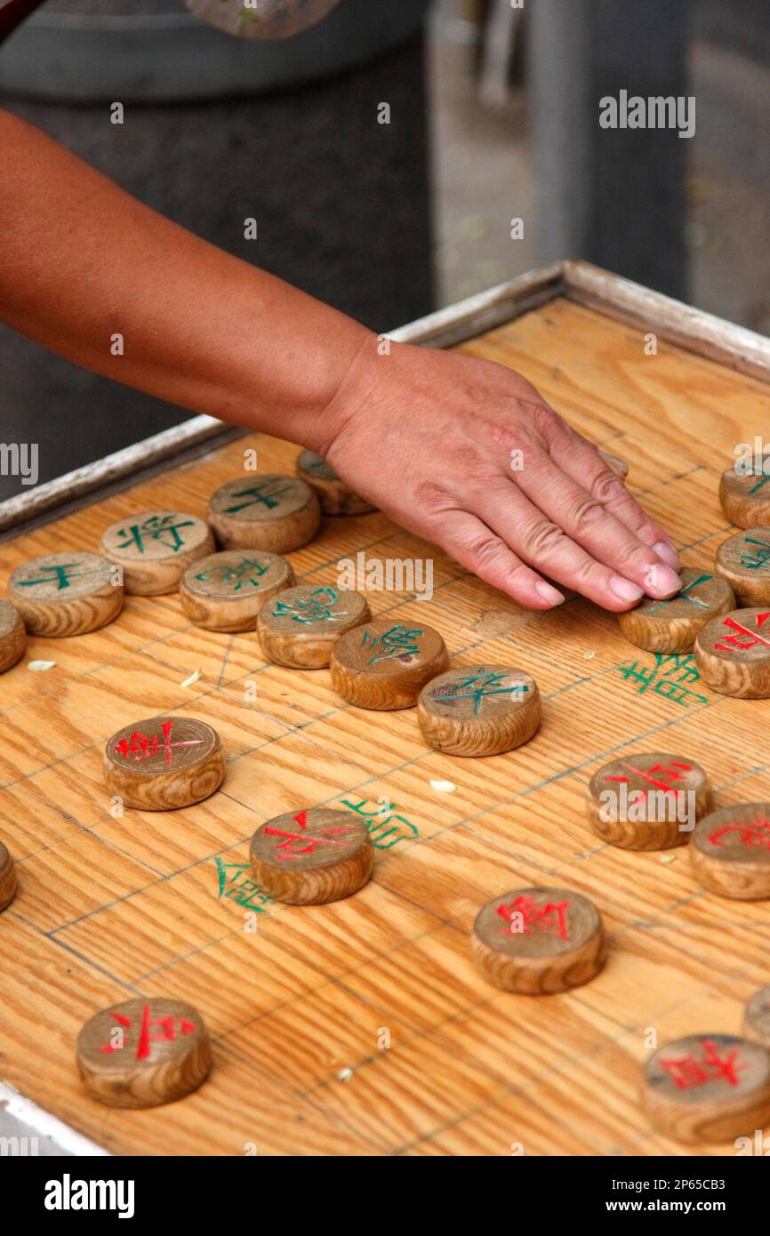 people playing Chinese checkers on the street. Beijing, China Stock ...