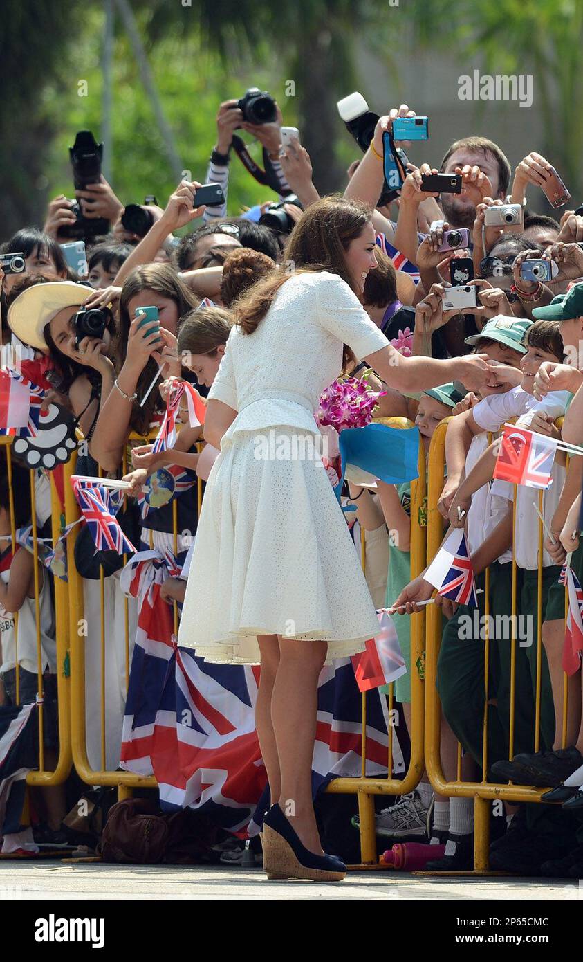 Catherine Middleton, Duchess of Cambridge, dressed in a white Alexander ...