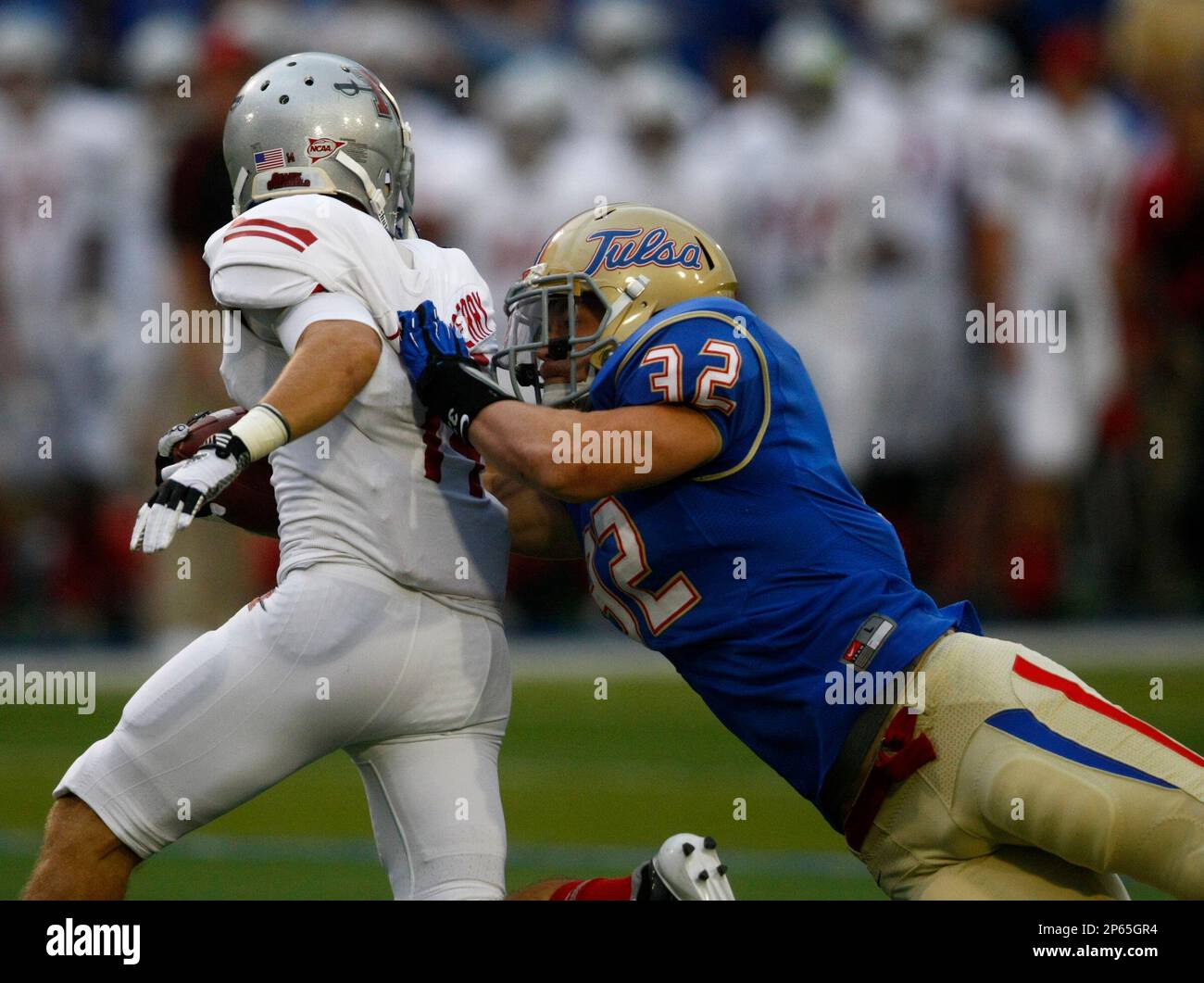 Tulsa's Mitchell Osbourne(32) brings down Nicholls State's Josh ...
