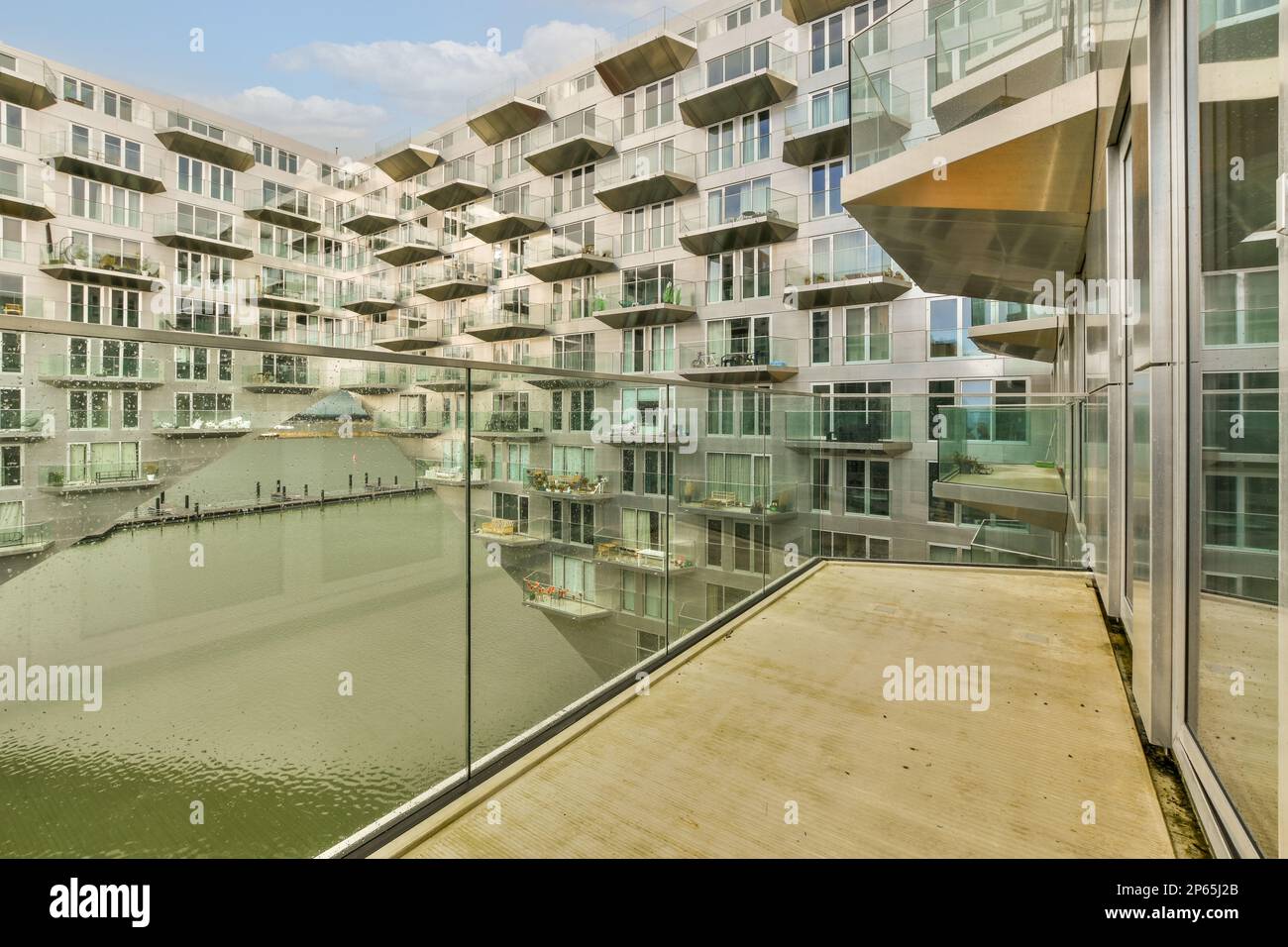 an outside area with buildings and water in the fore - lit part of the ...