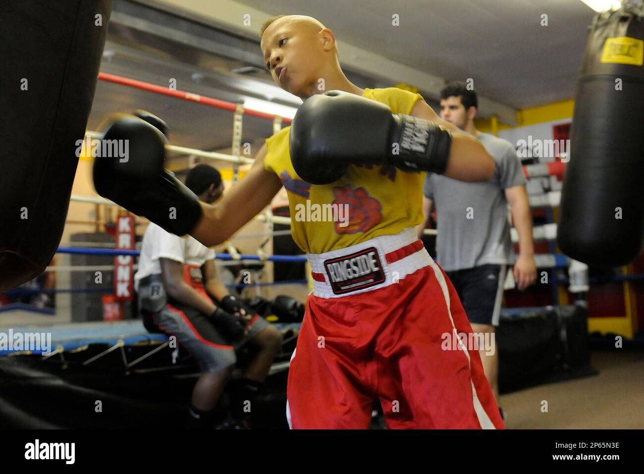 Boxer Shahid Porter, 11, hits the bag during practice at Kronk Gym on ...