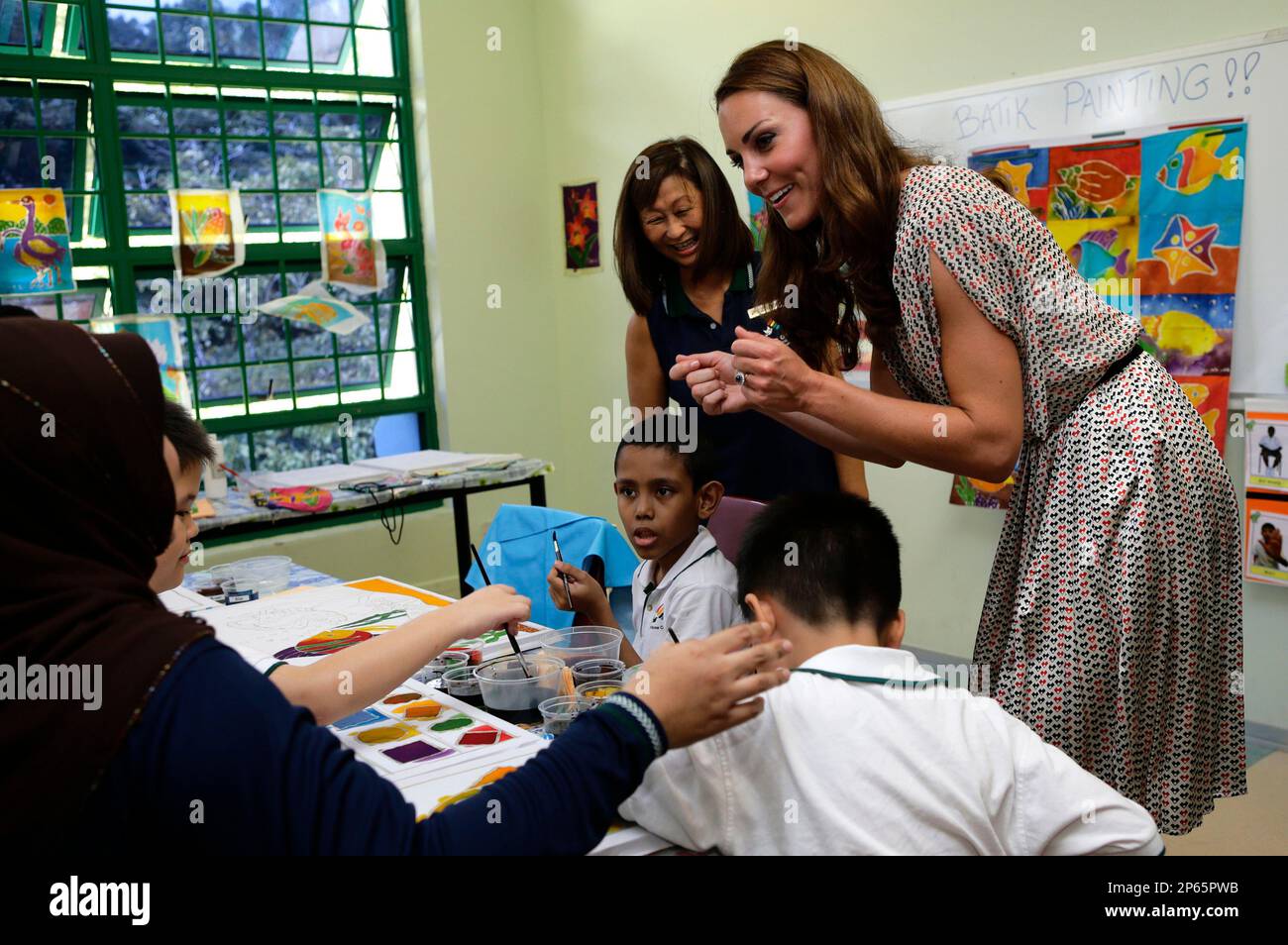 Kate, Britain's Duchess of Cambridge, talks with a student as she ...
