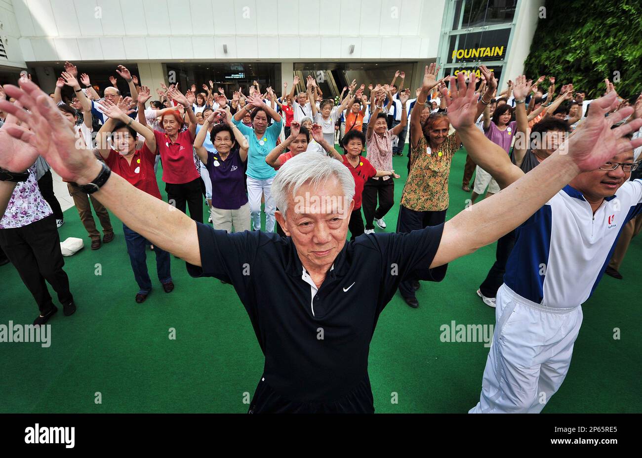 Mr Tan Howe Liang, Singapore's first Olympic medalist, leads about 60 ...