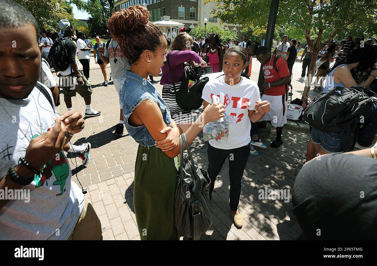 Senior Crystal Davis, 20, wears a "Vote 2012" shirt as she helps fellow ...