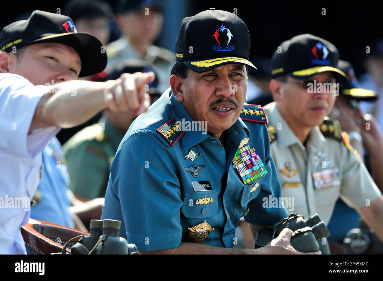 Singapore's Chief of Navy, Rear Admiral Ng Chee Peng (left), gestures ...