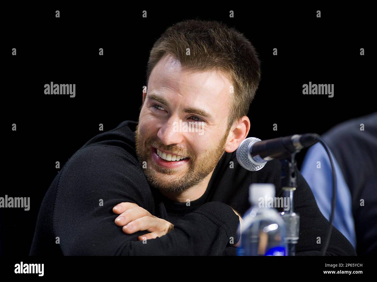Actor Chris Evans smiles during the press conference for the film "The ...