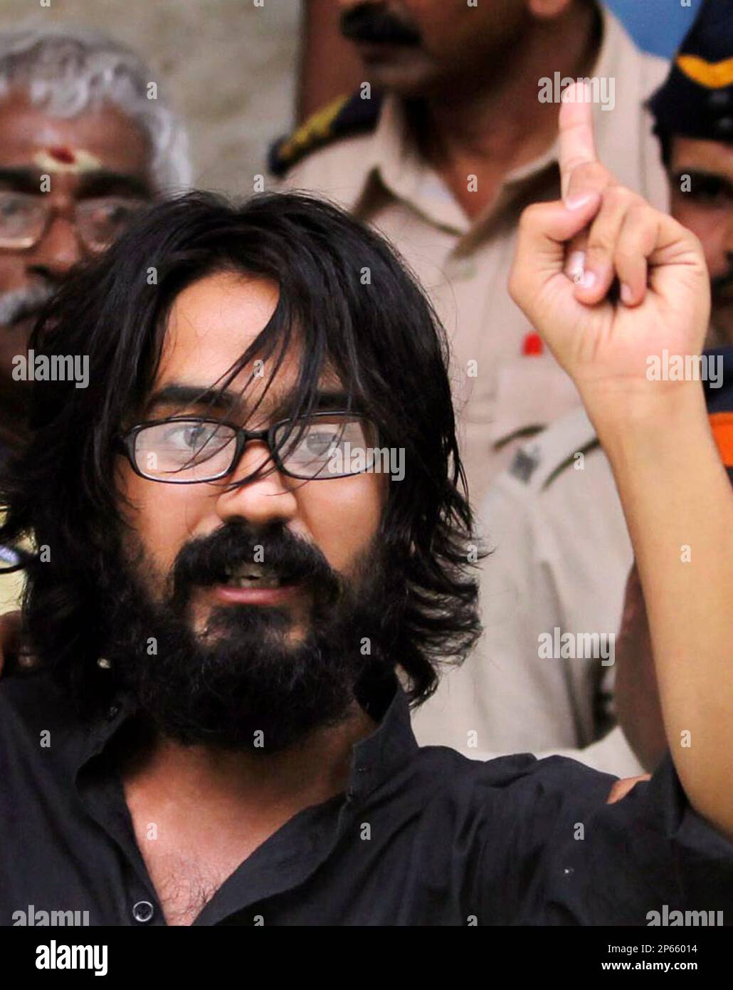 Indian political cartoonist Aseem Trivedi gestures after he is arrested ...