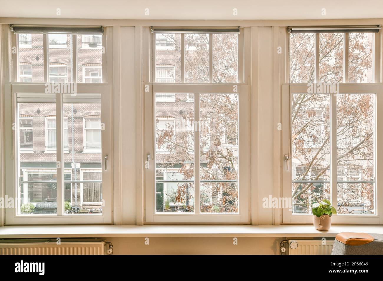 some windows in a house that has been painted white and the window ...