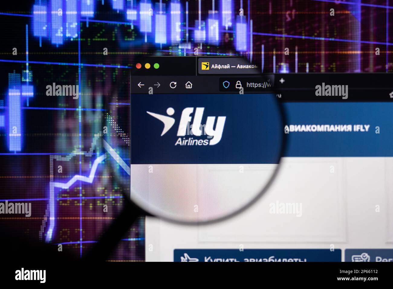 Fly airlines company logo on a website with blurry stock market developments in the background ...
