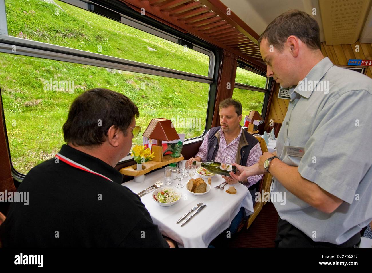 Switzerland, Canton Valais, Glacier express, lunch time in the dining ...