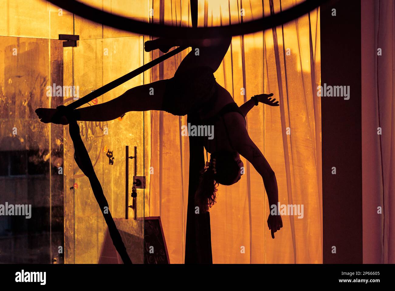 A Colombian aerial dancer performs on aerial silks during a training ...