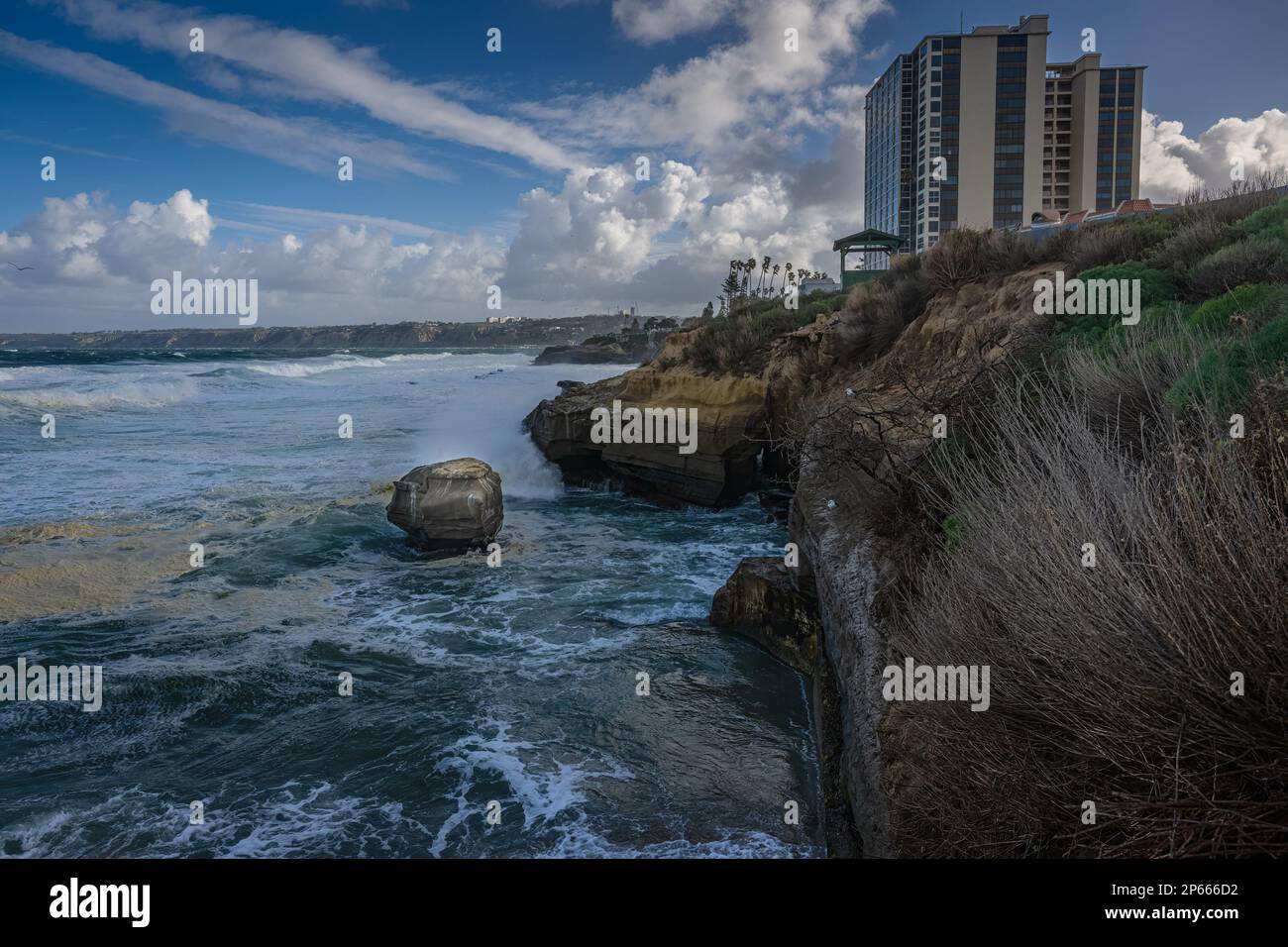 A beautiful shot of the scenic La Jolla rocky coast with splashing ...