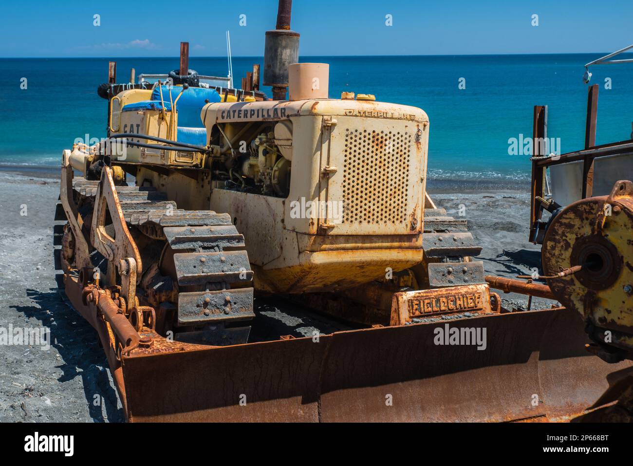 An old rusty Caterpillar D4c bulldozer on a beach in New Zealand Stock ...