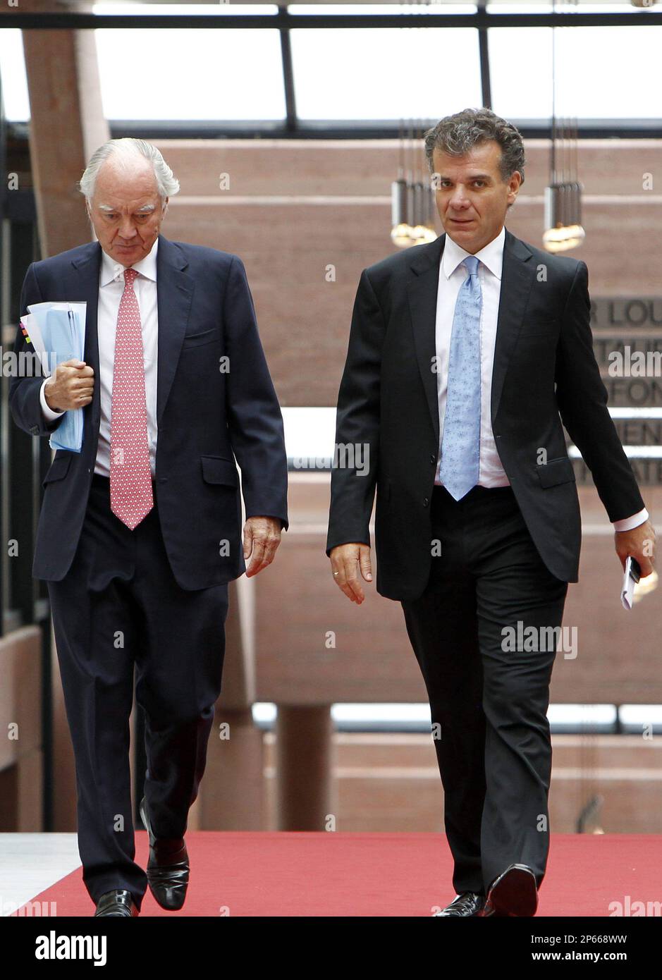 Sir John Bond, Chairman of the Board, left, and Thras Moraitis ...