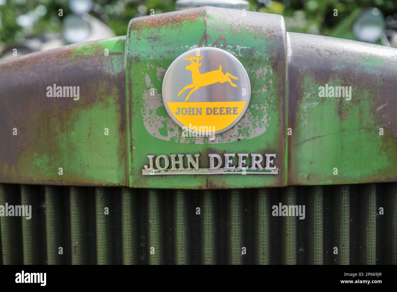 Chrome badge and logo on the front of a vintage John Deere Tractor ...