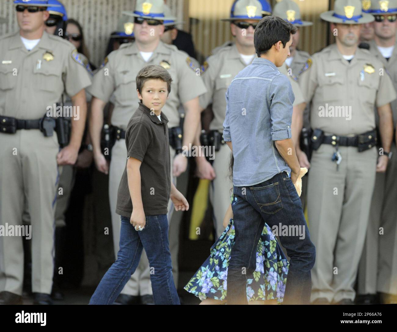 Andrew Youngstrom looks back as he leaves a memorial ceremony that ...
