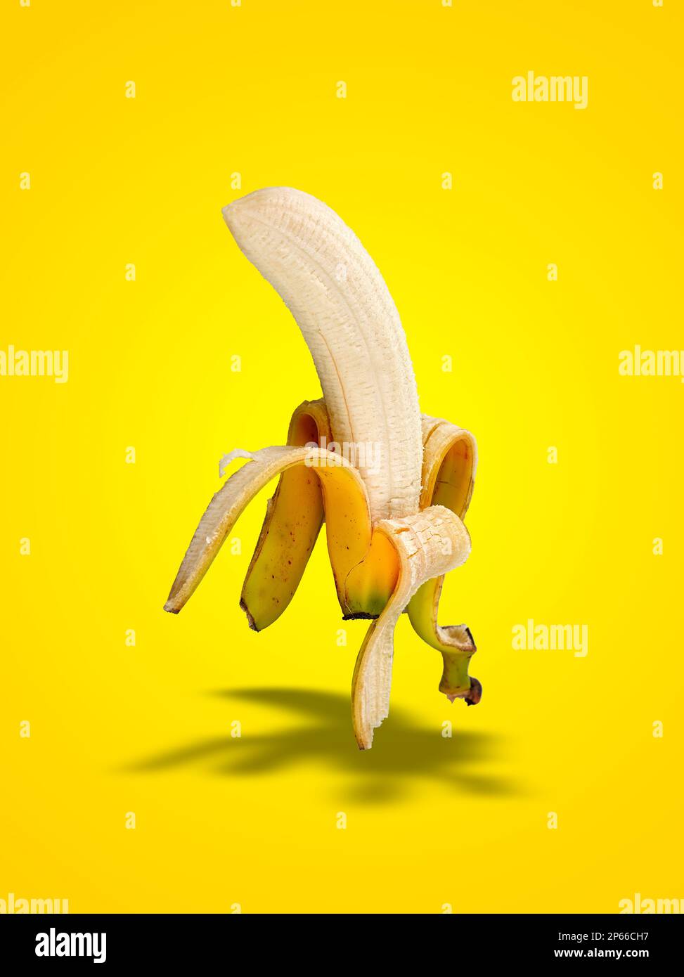 Floating Banana Peel with shadows on yellow gradient Stock Photo - Alamy
