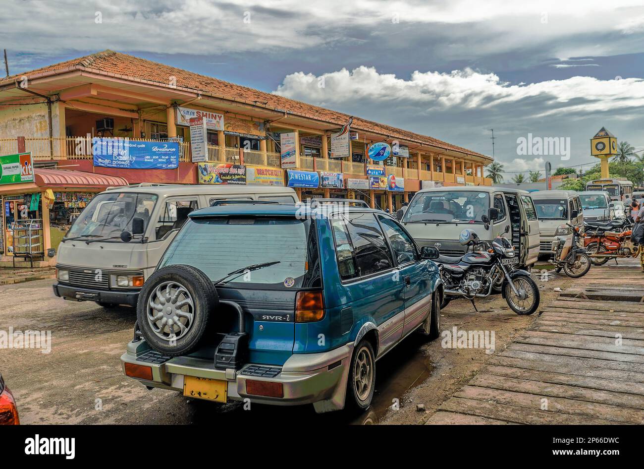 09 12 2007 Tourist SUV Cars at Cityscape of Negombo Market and clock ...
