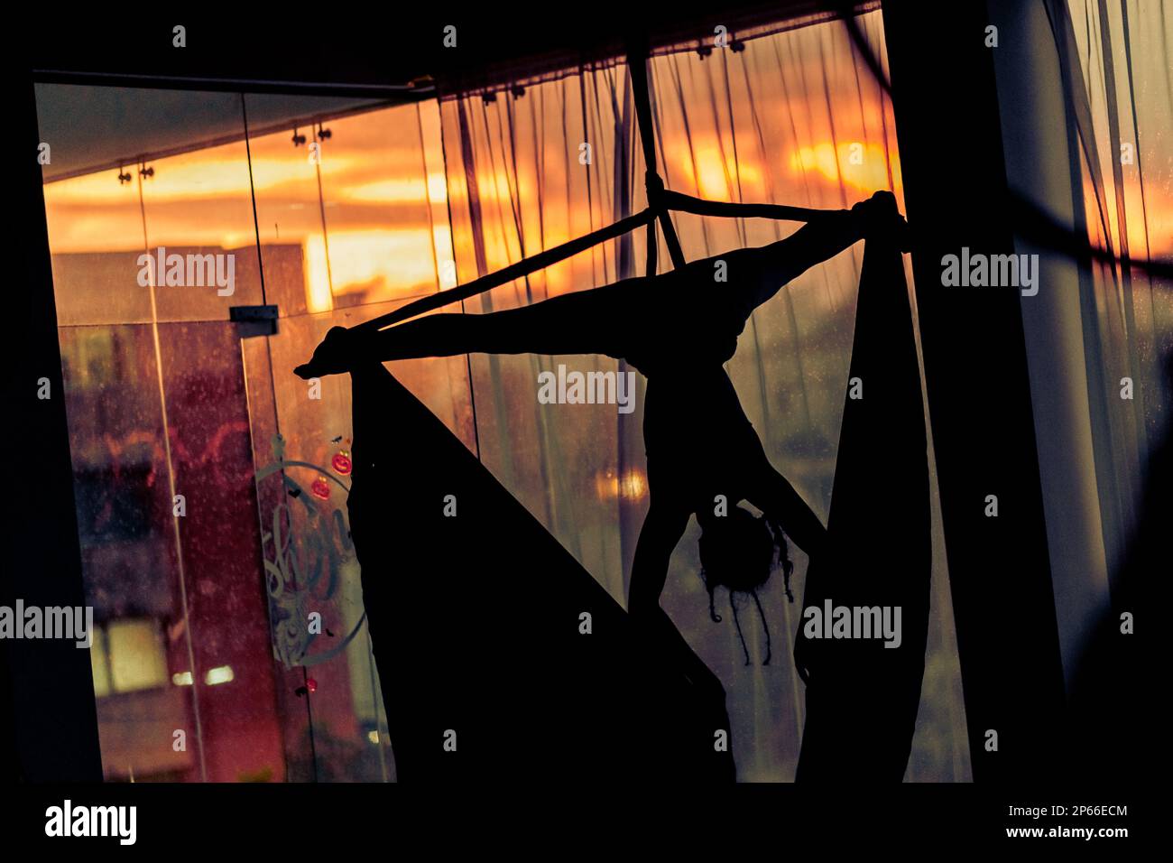 A Colombian aerial dancer performs on aerial silks during a training ...