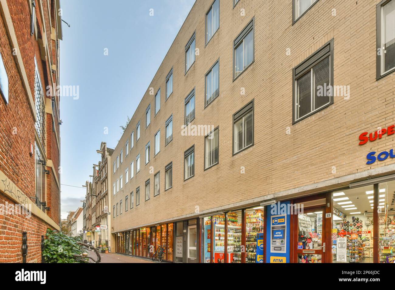 a city street with shops on both sides and buildings in the middle one ...