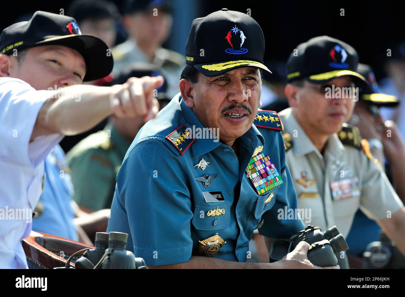 Singapore's Chief of Navy, Rear Admiral Ng Chee Peng (left), gestures ...