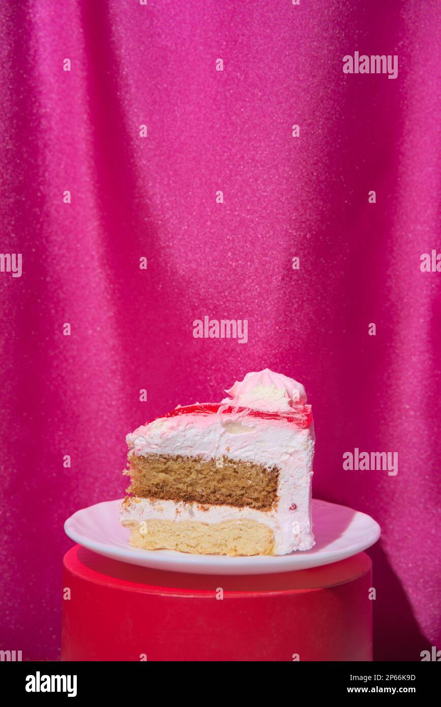A piece of birthday cake on a red catwalk. Magenta Curtains Background ...