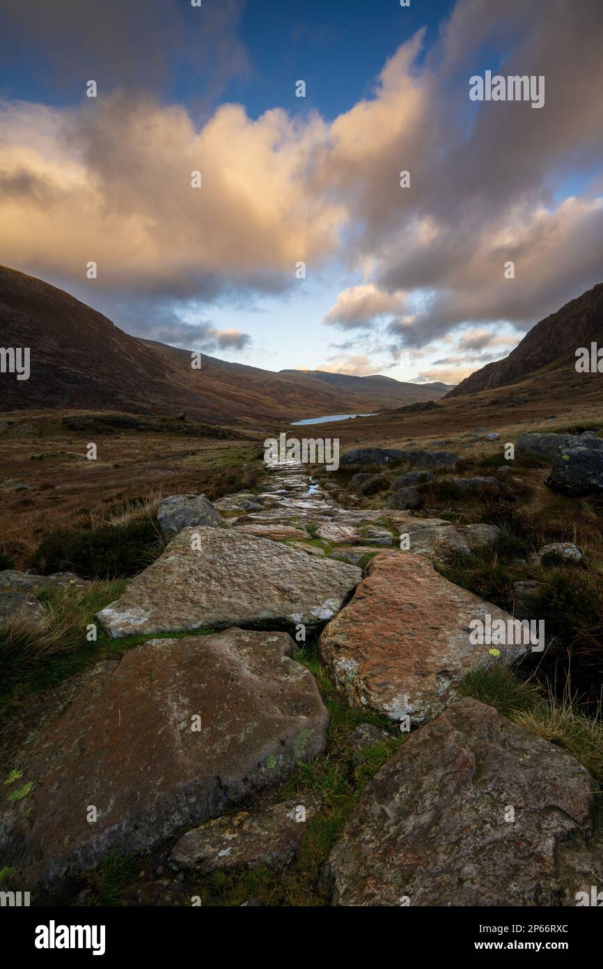 Stone footpath leading towards Llyn Ogwen in Snowdonia National Park ...