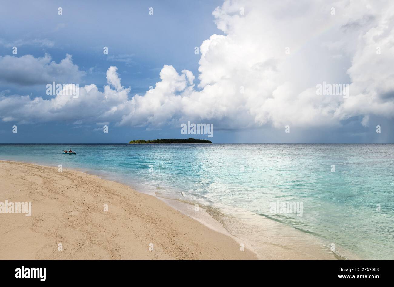 A couple canoeing in Baa Atoll, Maldives, Indian Ocean, Asia Stock ...