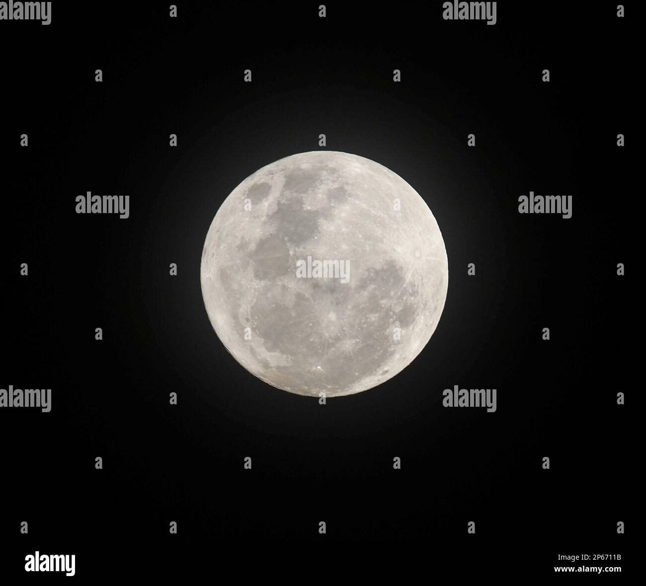 Photograph of the full moon as it rises over Singapore on 19 March 2011 ...