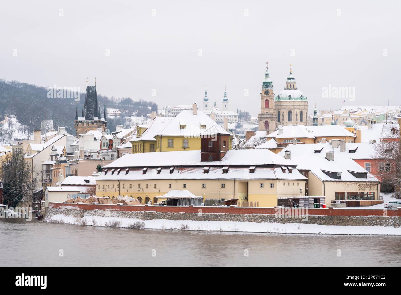 Lesser Quarter of Prague dominated by St. Nicolas Church with snow in ...