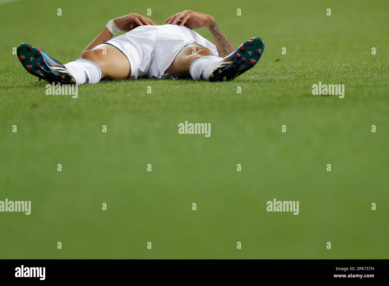 Real Madrid's Angel Di Maria from Argentina lies on the pitch during a ...