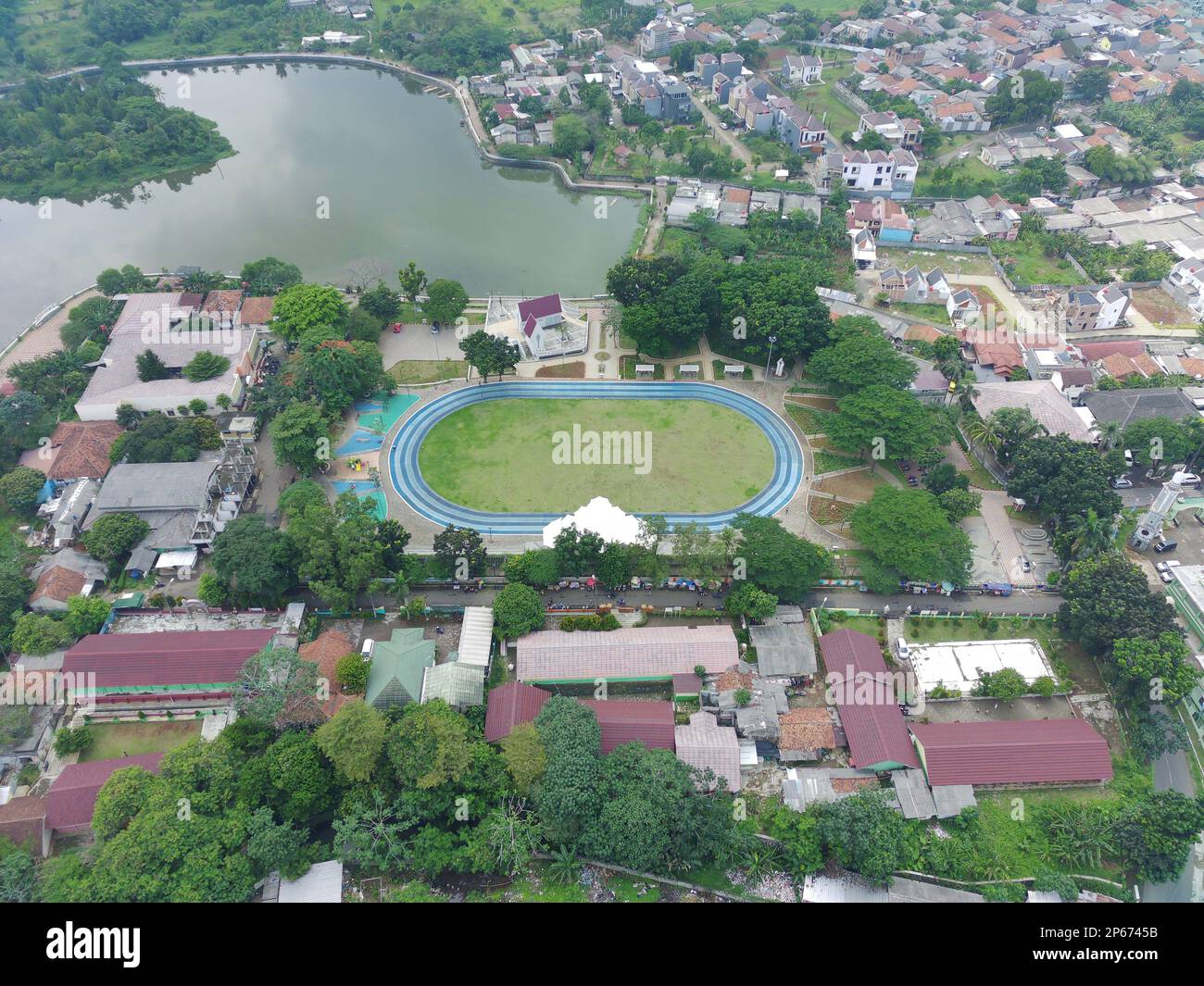 aerial view of a green open space called alun-alun Cirimekar for sports ...