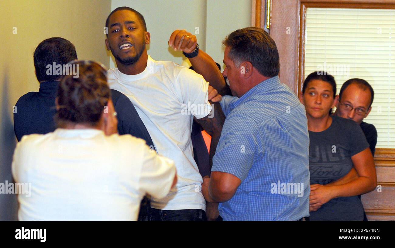 Brandon Brown, brother of shooting victim Dustin Kelly, is restrained ...