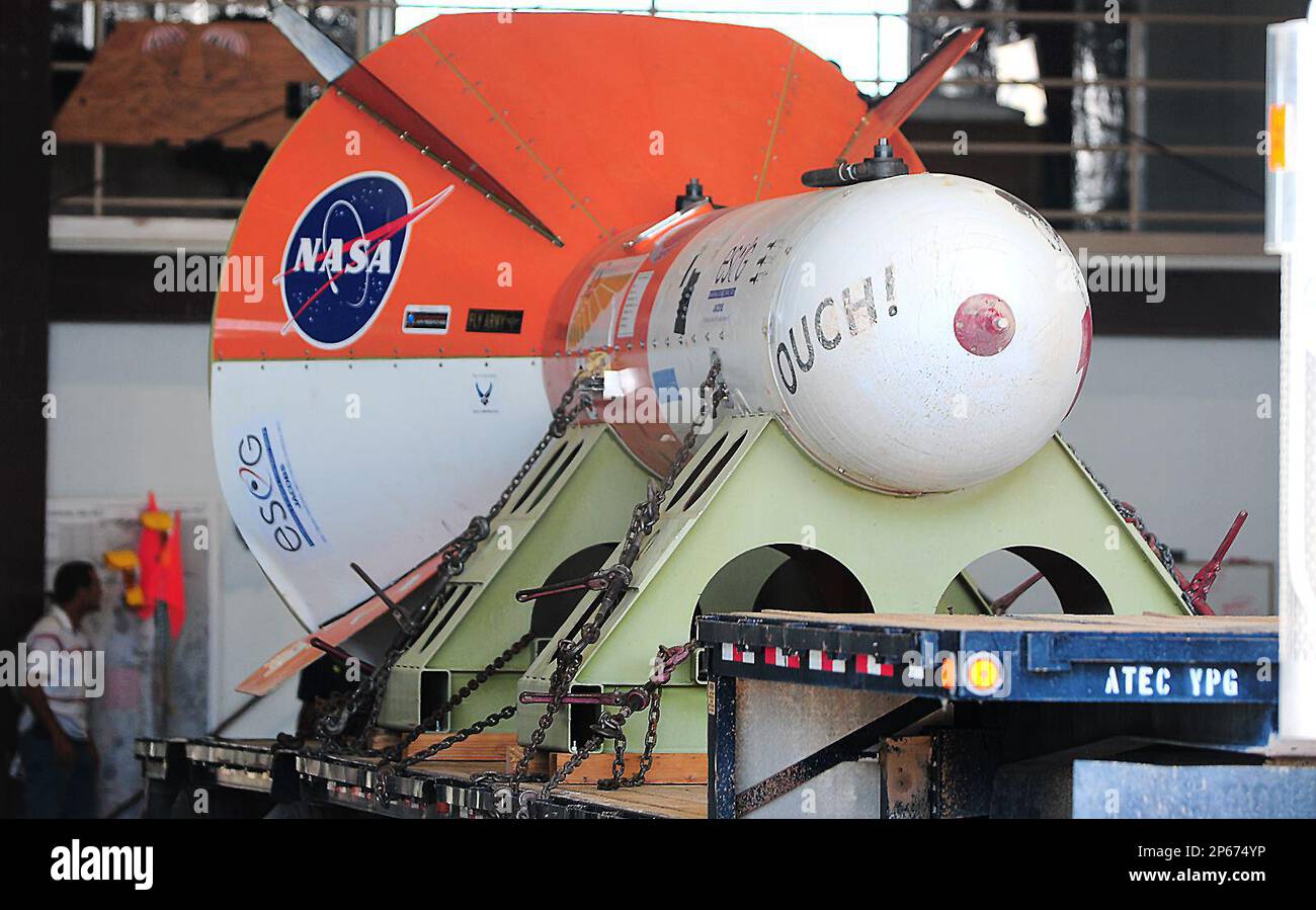 The NASA Parachute Compartment Drop Test Vehicle (PCDTV) is carefully ...