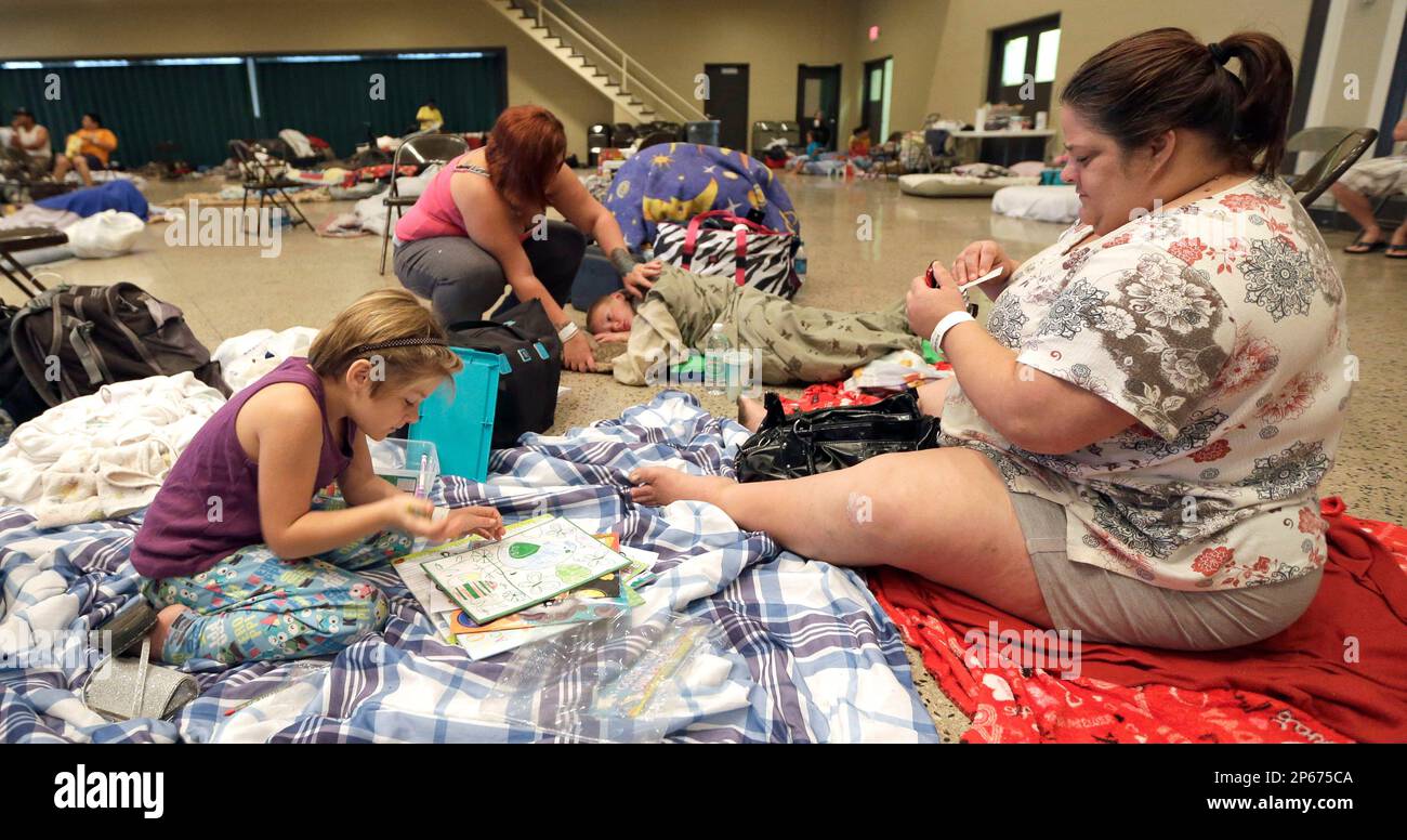 Krystal Ledet, back left, looks after her son, Brandon Malbrough as her ...
