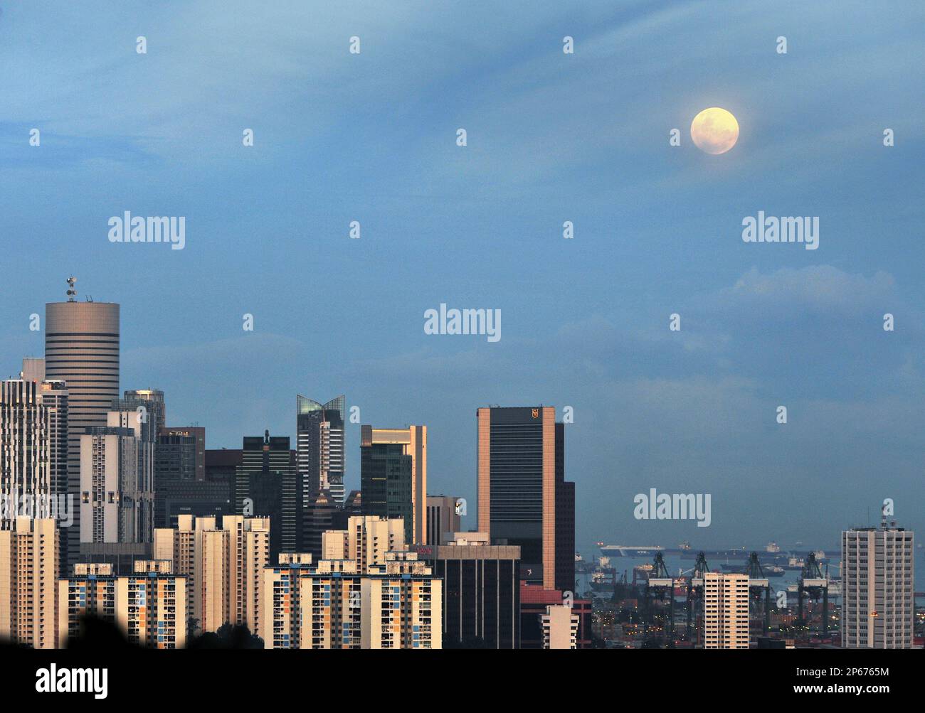 Photograph of the full moon as it rises over Singapore on 19 March 2011 ...